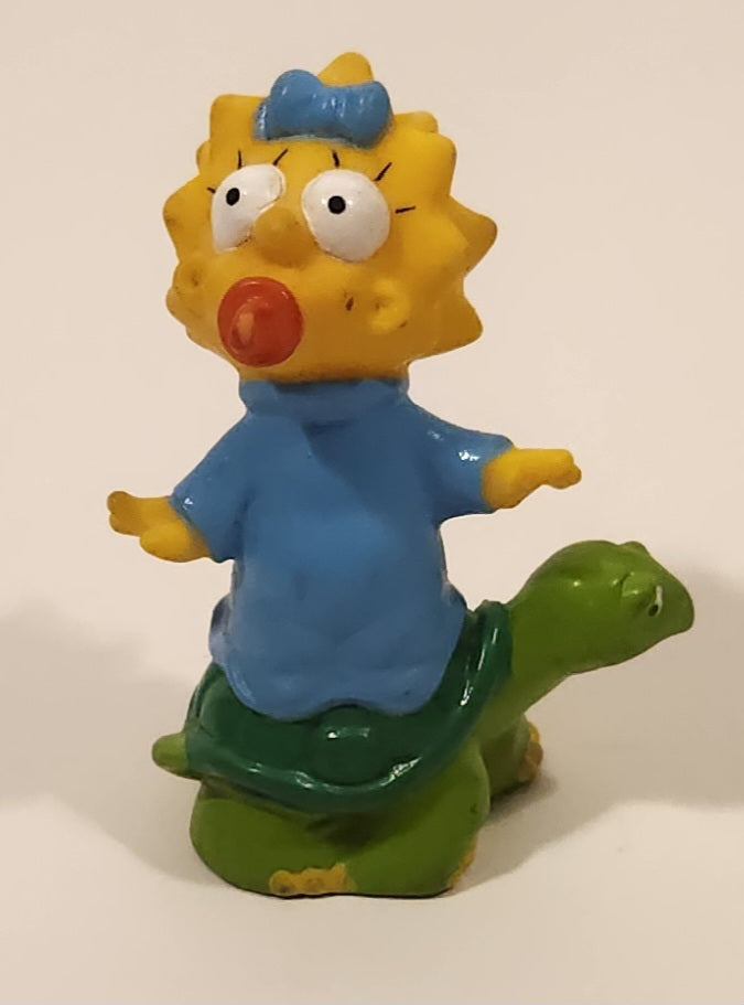 1990 TCFFC 139 The Simpsons Maggie Simpson on Turtle 2 3/4" Tall Rubbe ...
