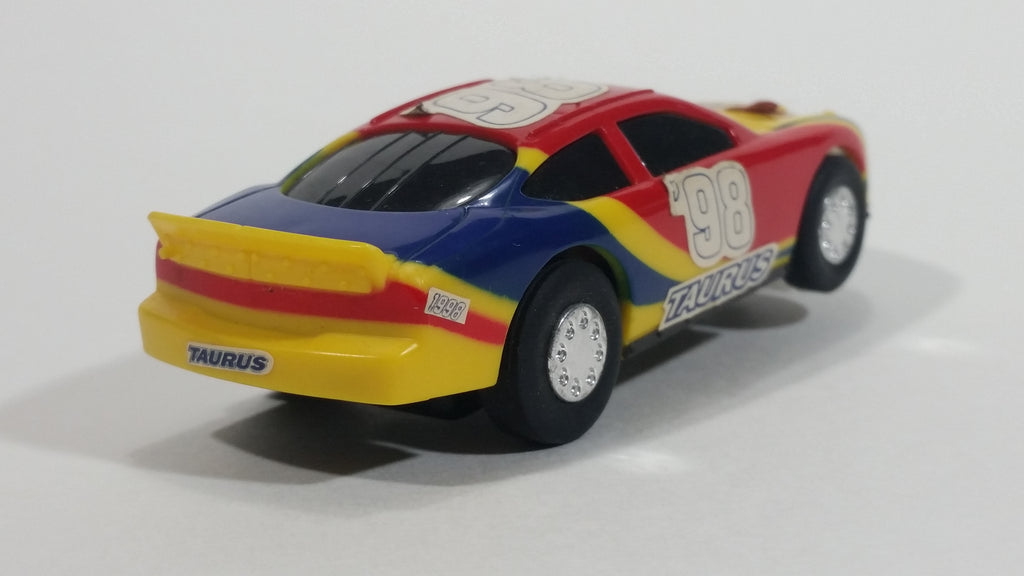 Tyco 1998 Ford Taurus Yellow Blue Red NASCAR Racing Plastic Toy Slot C ...